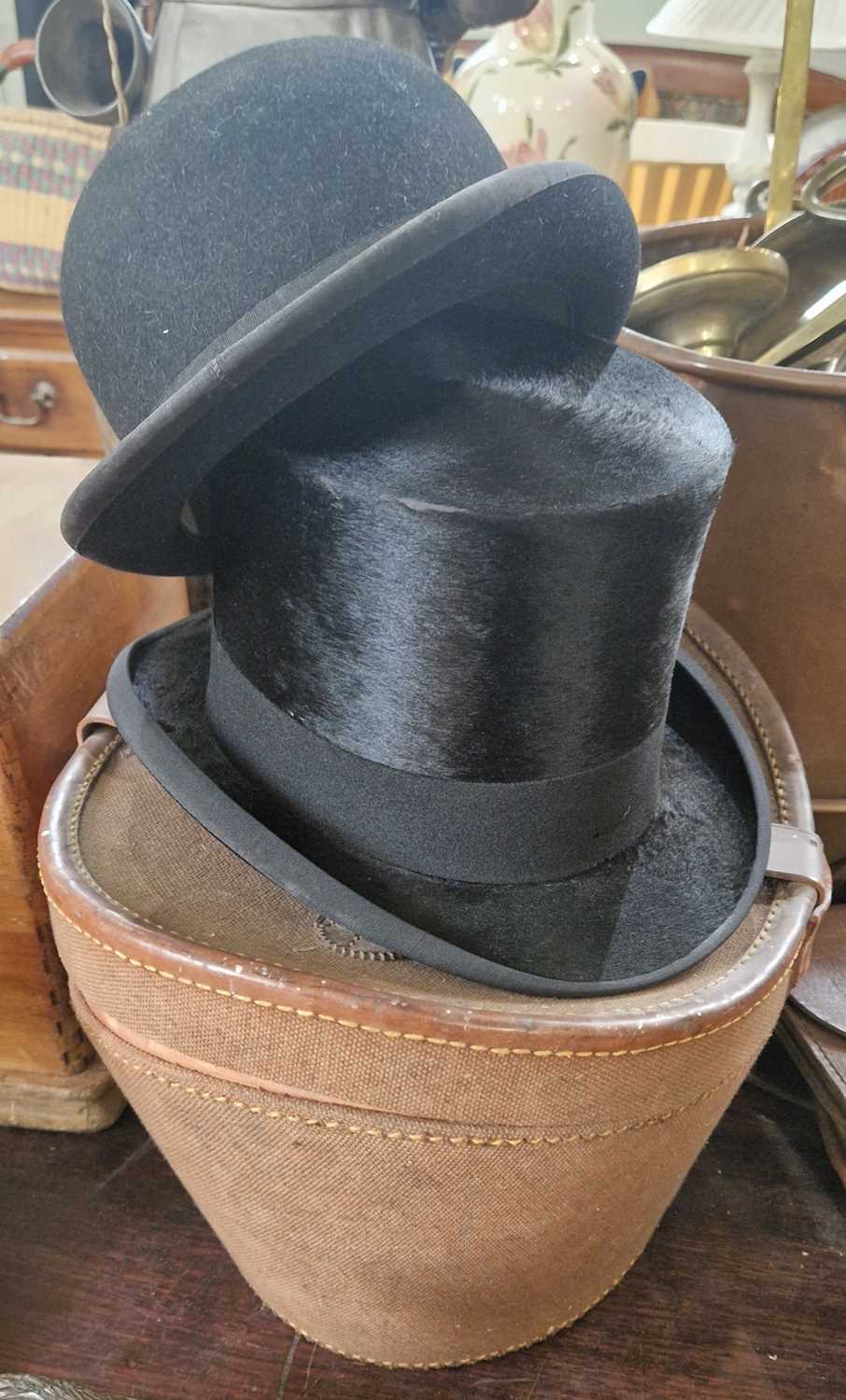Lot 406 - A canvas and leather cased top hat, London
